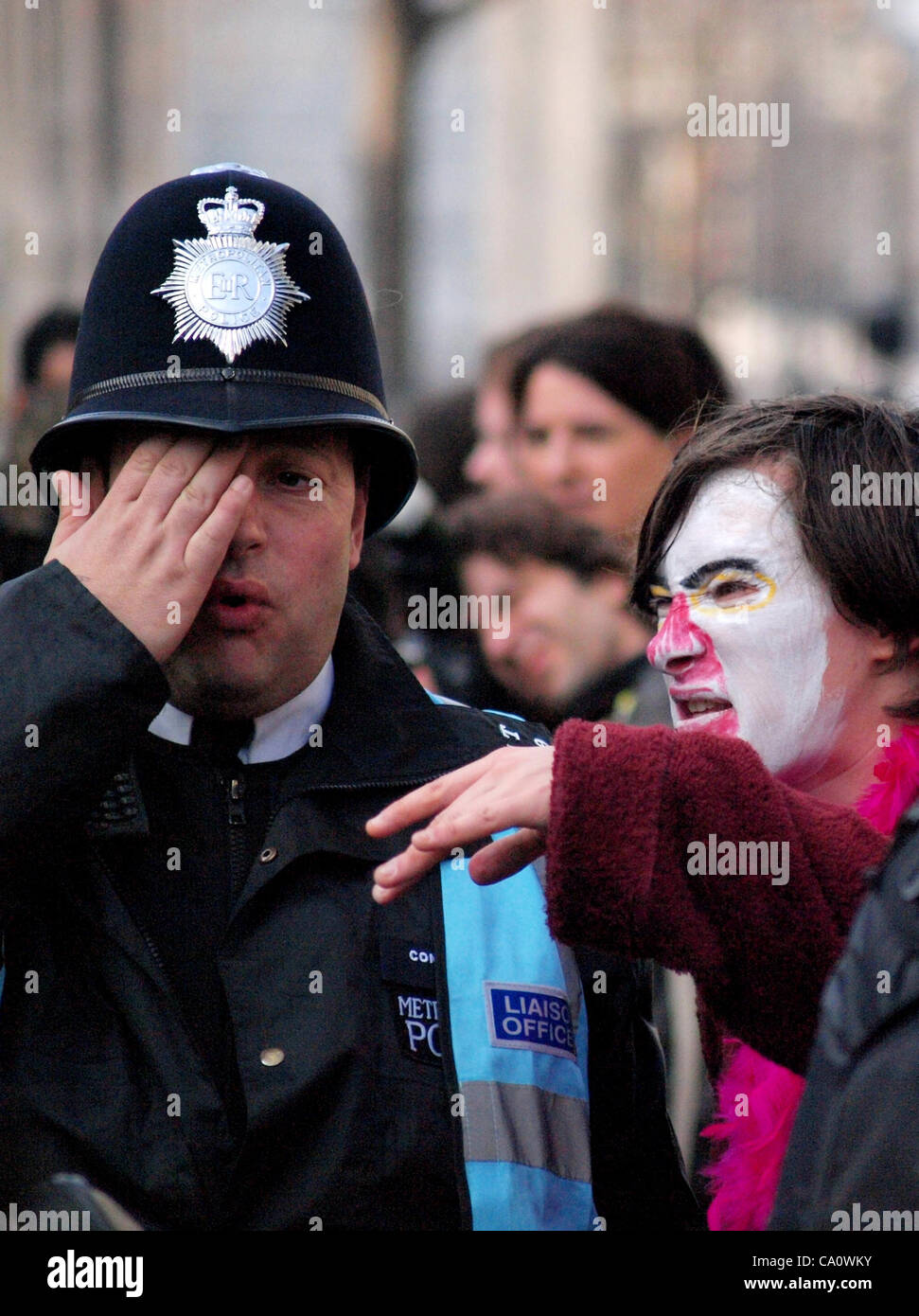 London, UK. 14/03/12. Members of the Clown Army protest movement put ...