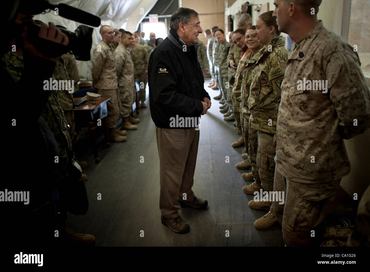 US Defense Secretary Leon Panetta greets service members transiting ...