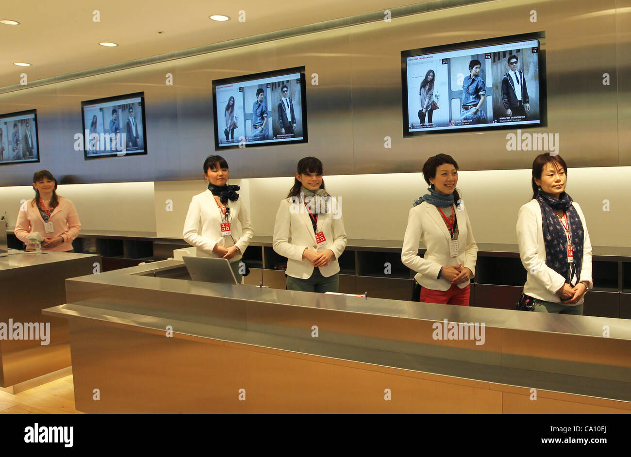 March 16, 2012 - Tokyo, Japan - Store staff wait for customers at the ...