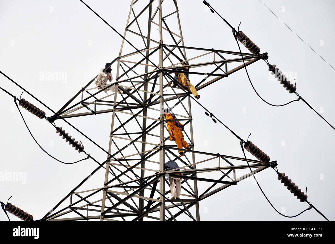 Angry protesters climb the high-tension-electricity-pylon during ...