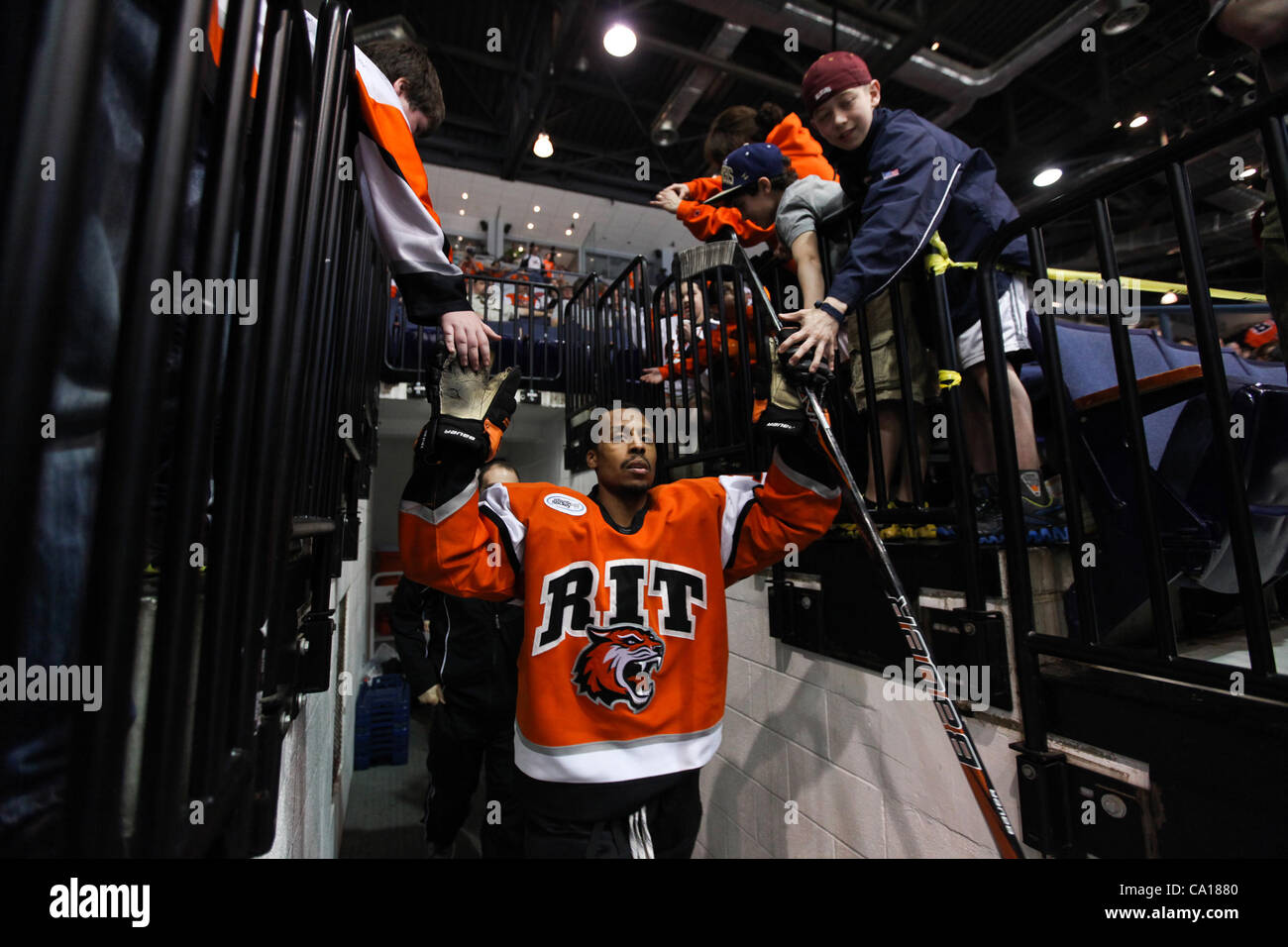 March 17, 2012 - Rochester, New York, U.S. - Cameron Burt of RIT slaps ...