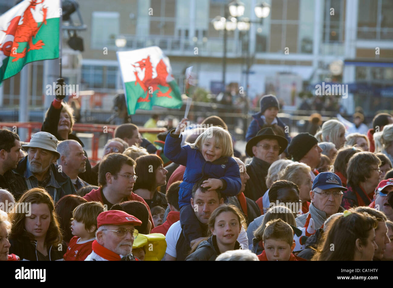 Welsh rugby fans watching the Welsh rugby team celebrate winning the ...