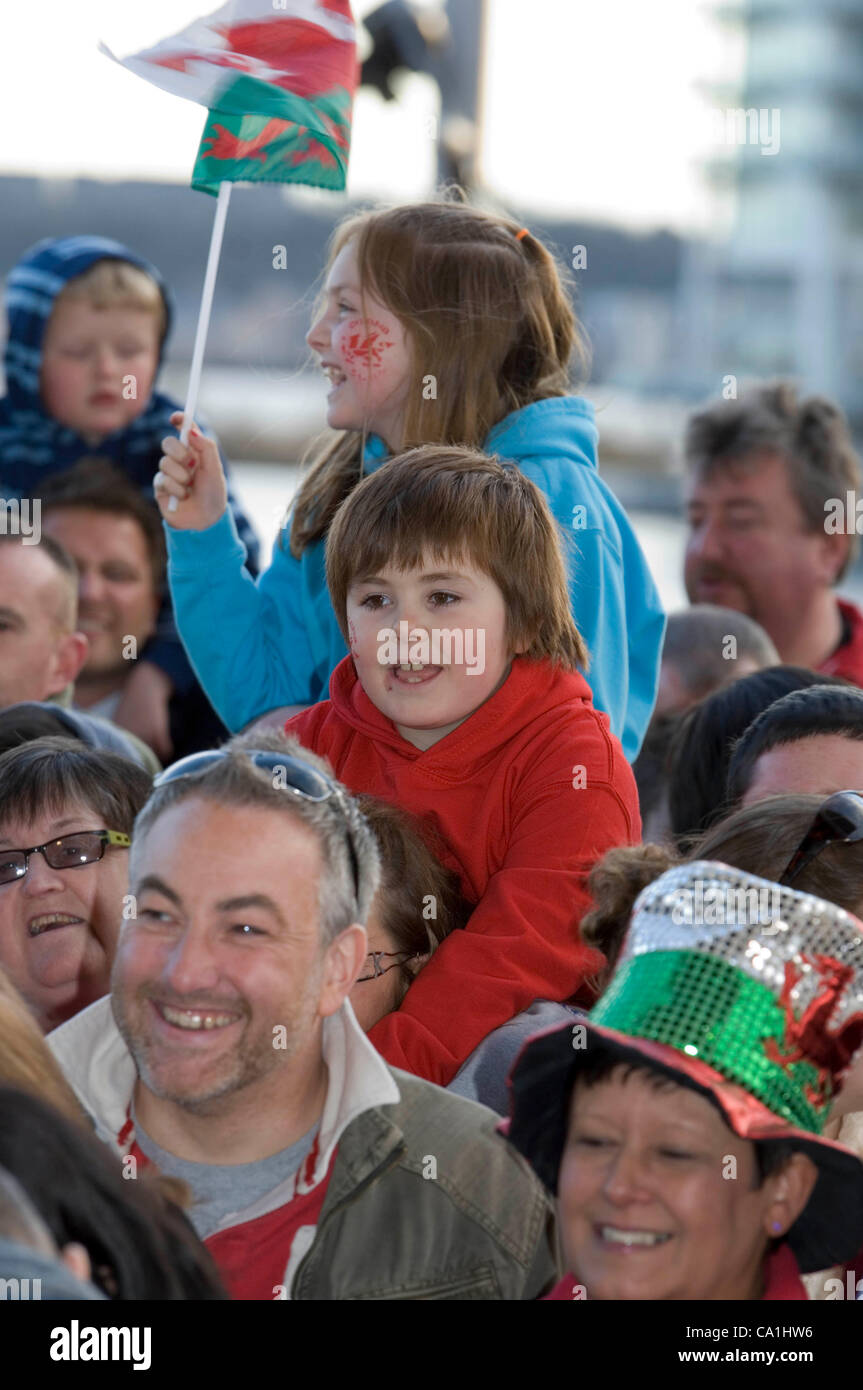 Welsh rugby fans watching the Welsh rugby team celebrate winning the ...