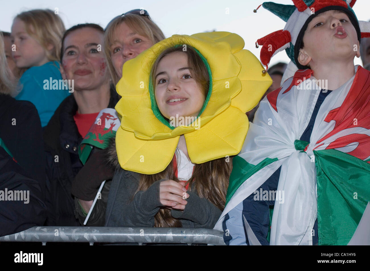 Welsh rugby fans watching the Welsh rugby team celebrate winning the ...