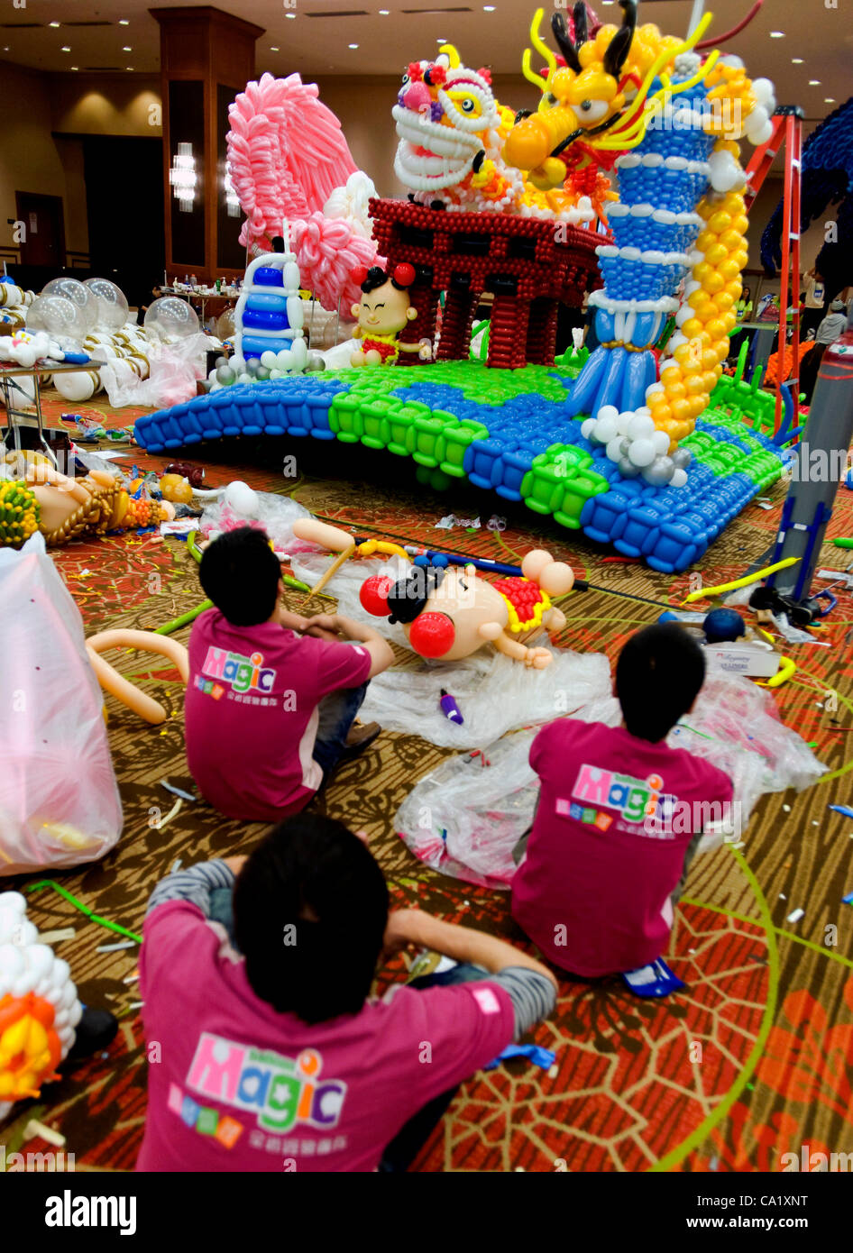 Dallas, Texas, US. Mar 21, 2012. Balloon artists representing Magic ...