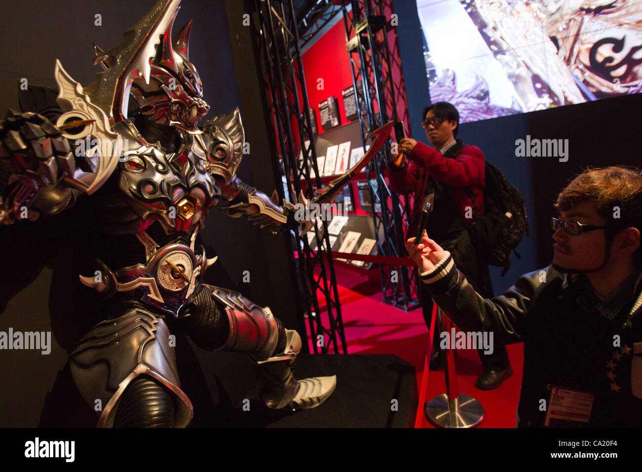 March 22, 2012, Tokyo, Japan - Visitors take photos of a character ...