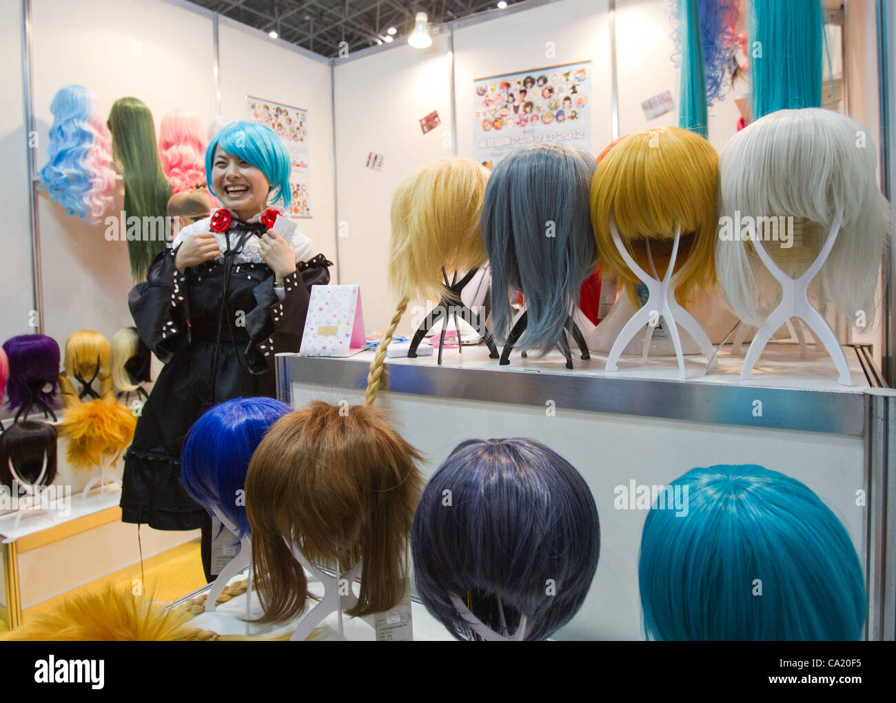 March 22, 2012, Tokyo, Japan - A staff cosplayer working at a booth ...
