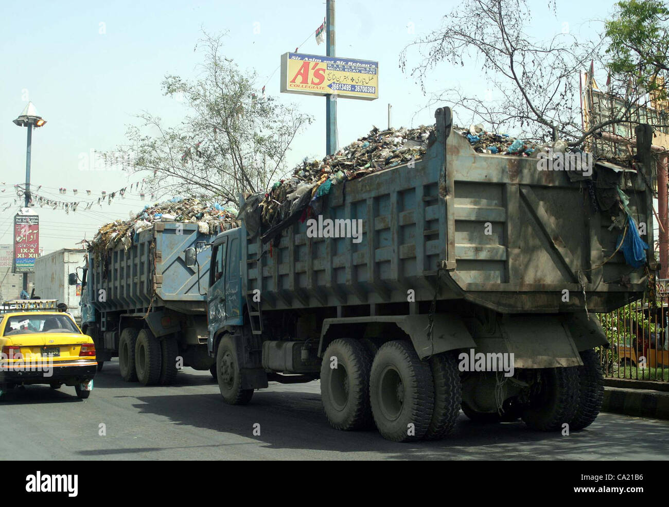 Nazimabad area karachi garbage trucks hi-res stock photography and ...