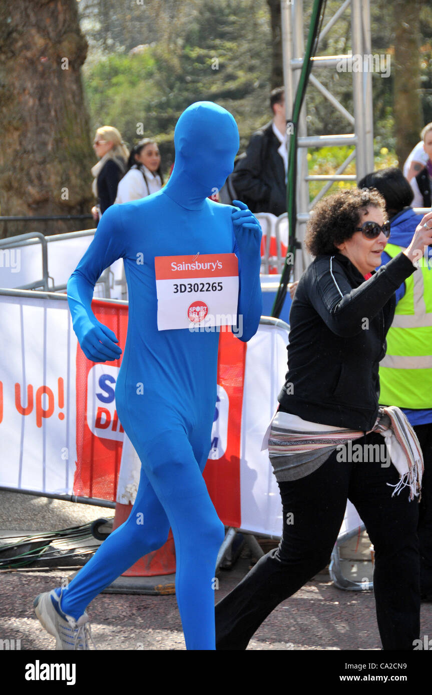A competitor wearing a one piece body suit runs the Sport Relief Mile ...
