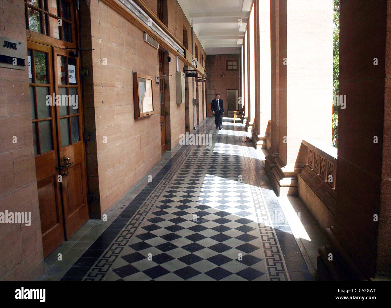 A lawyer passes through a lobby that gives desert look as lawyers ...