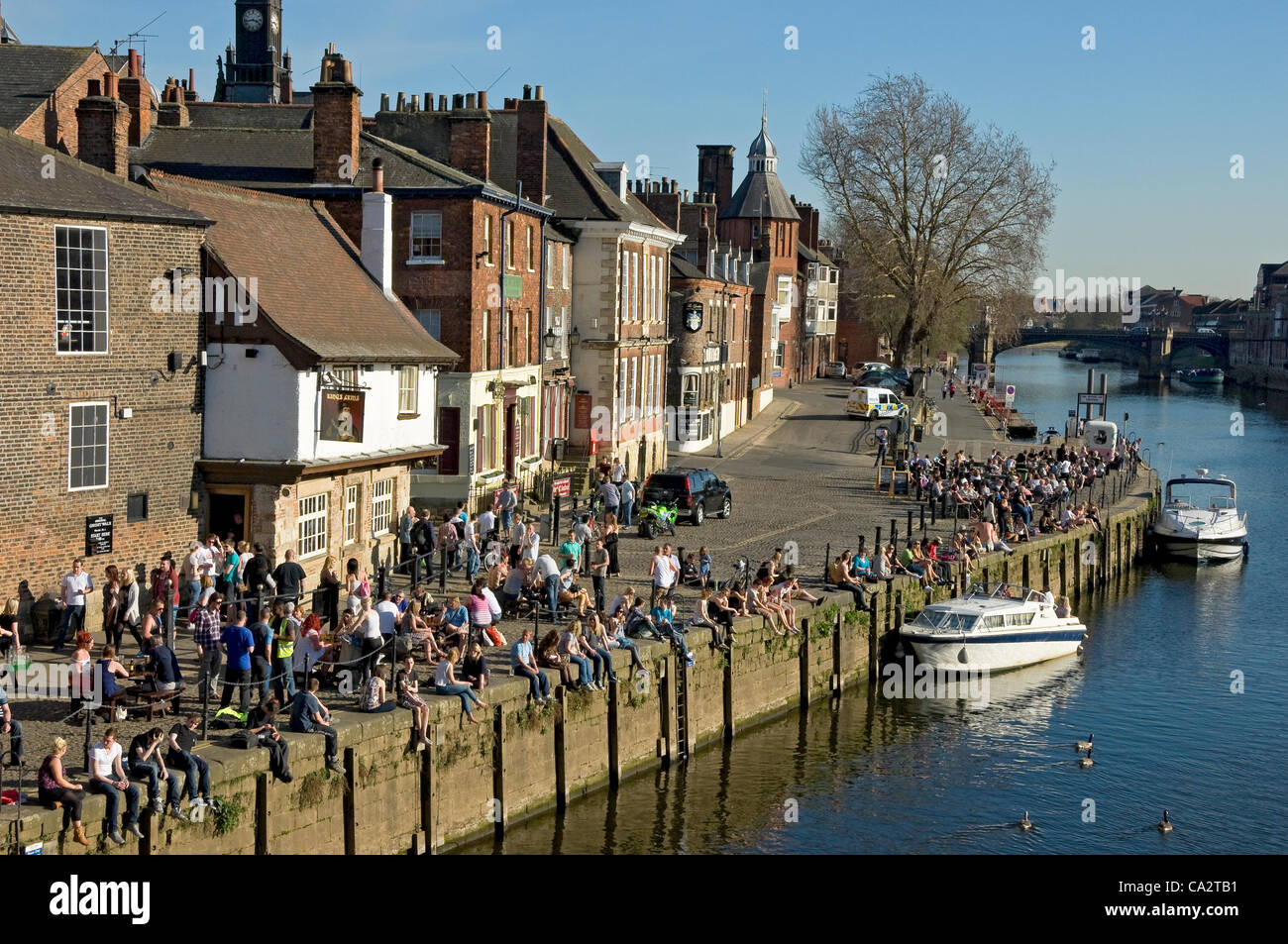 People tourists visitors relaxing by the Kings Arms pub next to the ...