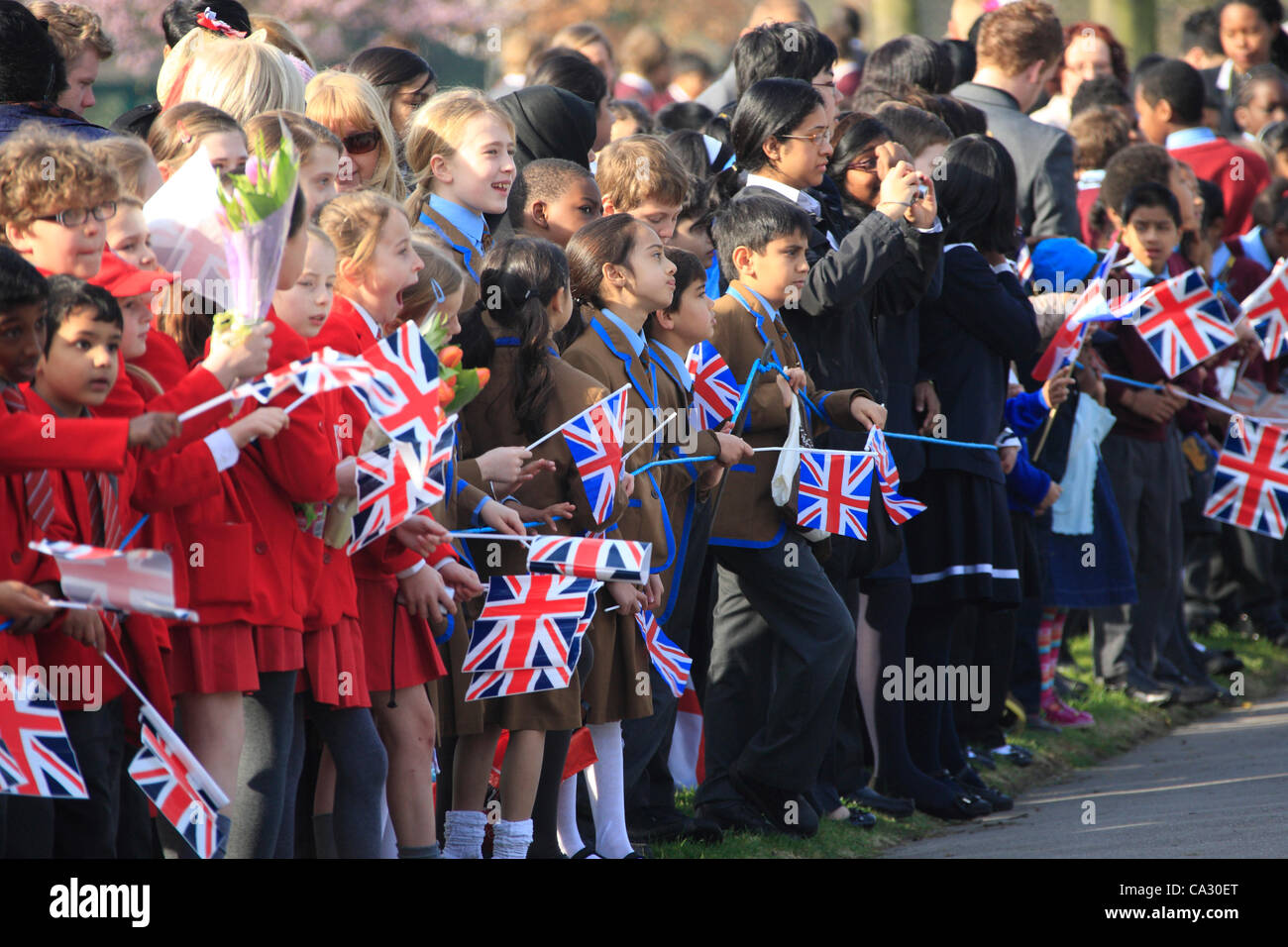 School children wave flags hi-res stock photography and images - Alamy