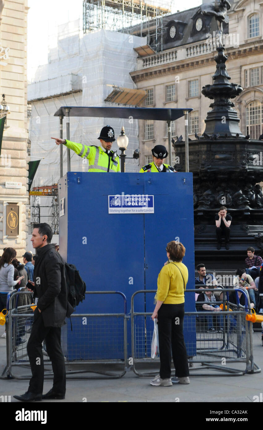 London, UK. 29/03/12. Metropolitan Police officers in a mobile watch ...
