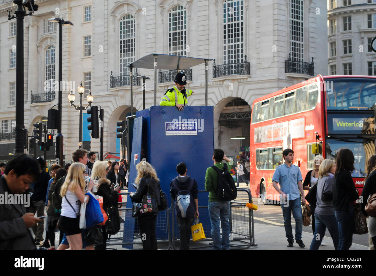 London, UK. 29/03/12. Metropolitan Police officers in a mobile watch ...