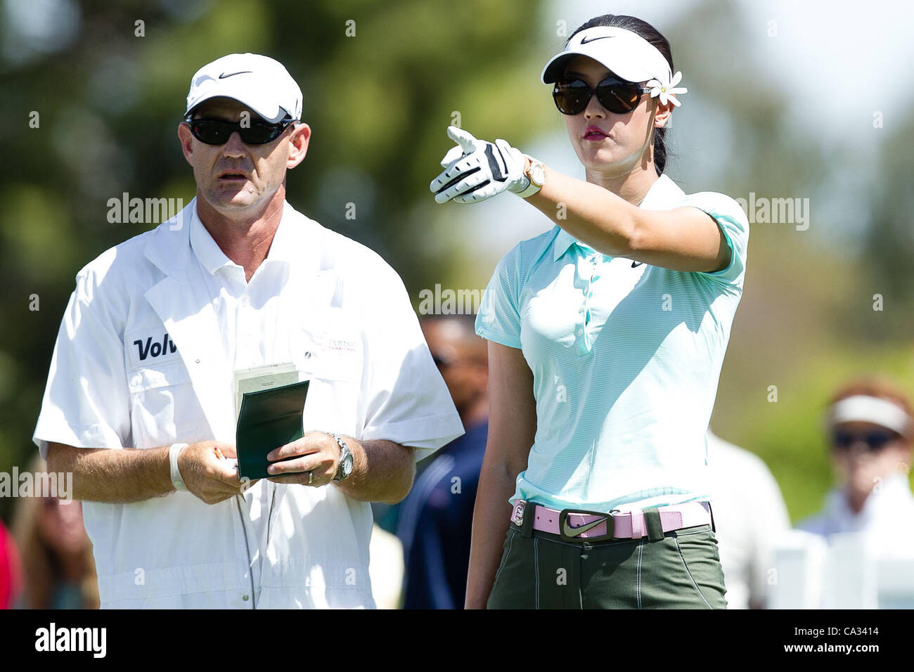Michelle Wie (right) of the United States in action during the first ...