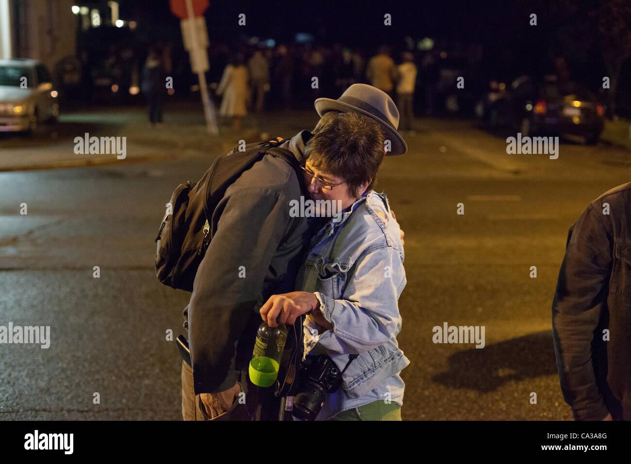 May 30, 2012 - A woman cries in front of Cafe Racer in Seattle, where a ...