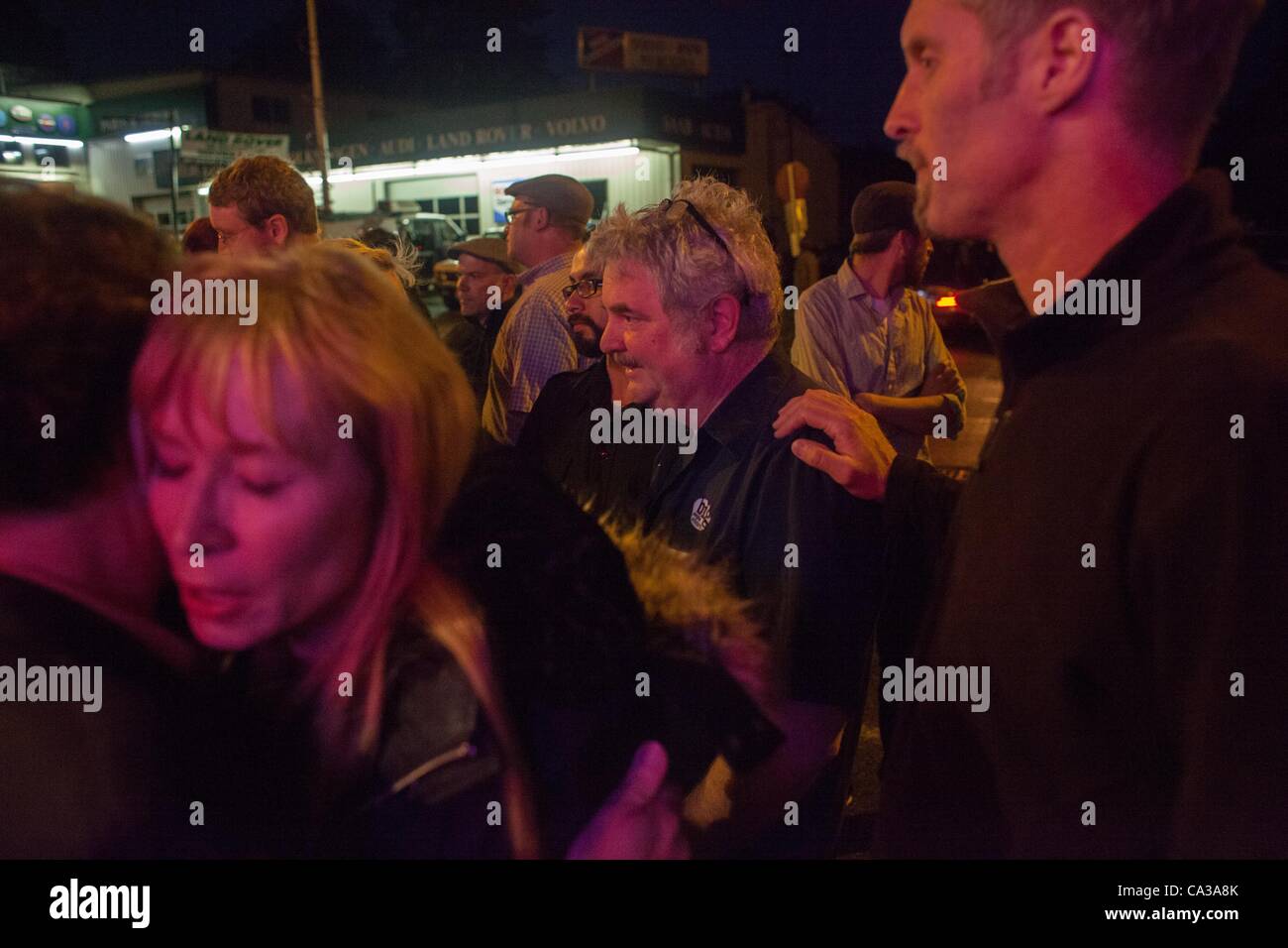 May 30, 2012 - People mourn in front of Cafe Racer in Seattle, where a ...