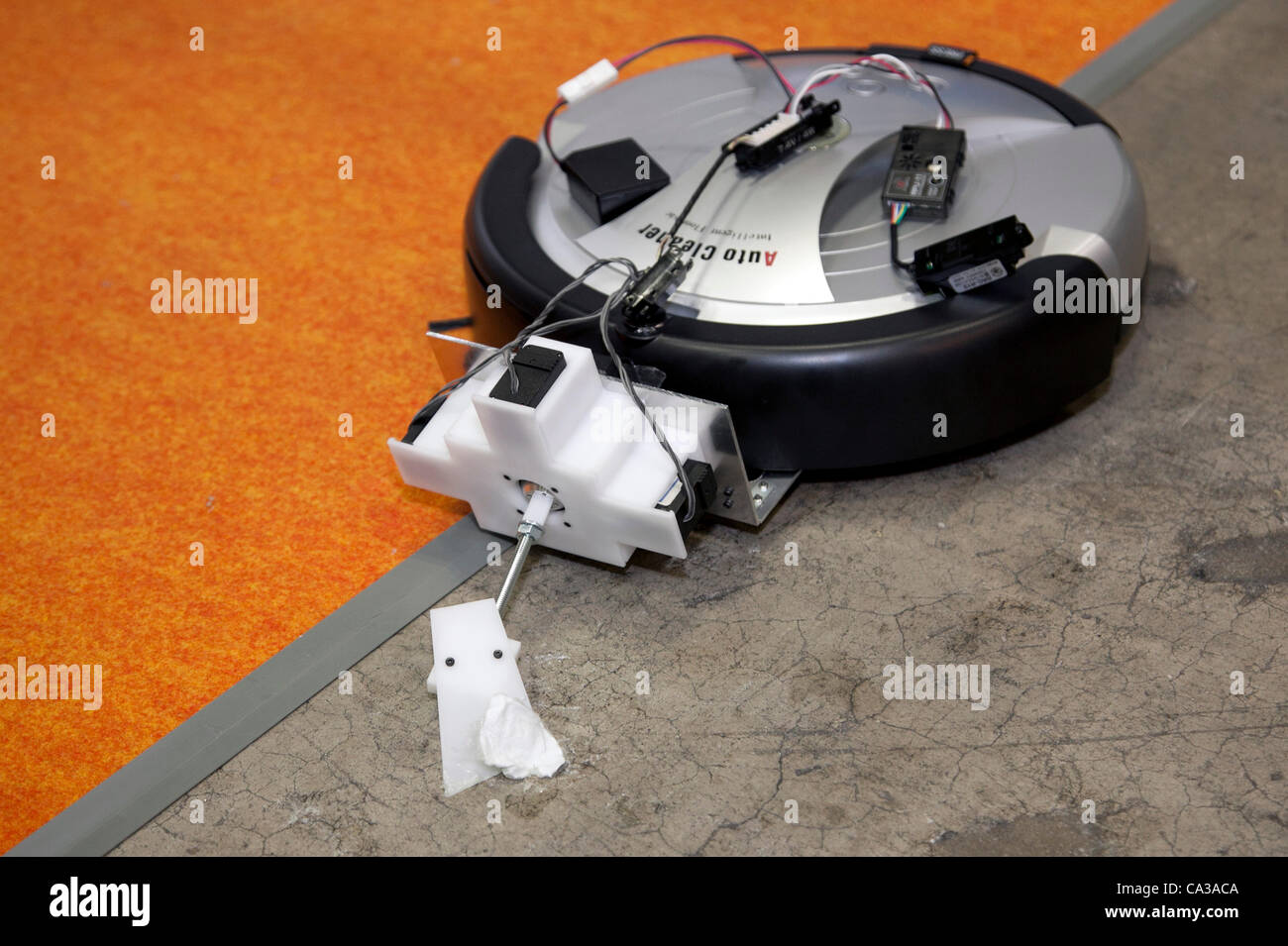 May 131, 2012, Tokyo, Japan - A small robot cleans the floor. The Smart ...