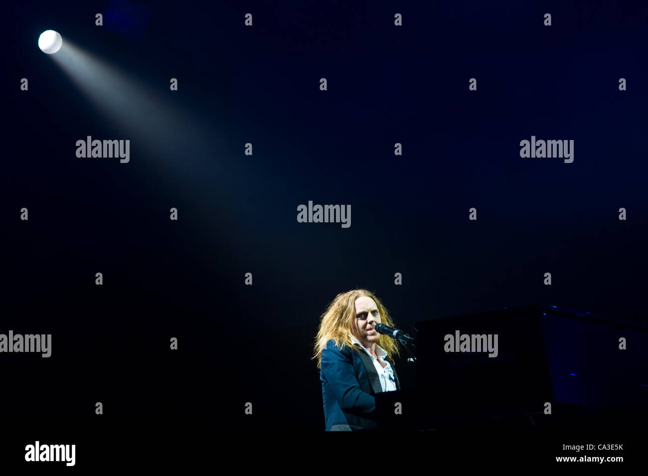 Tim Minchin, comedian and musician, performing on stage with his band ...