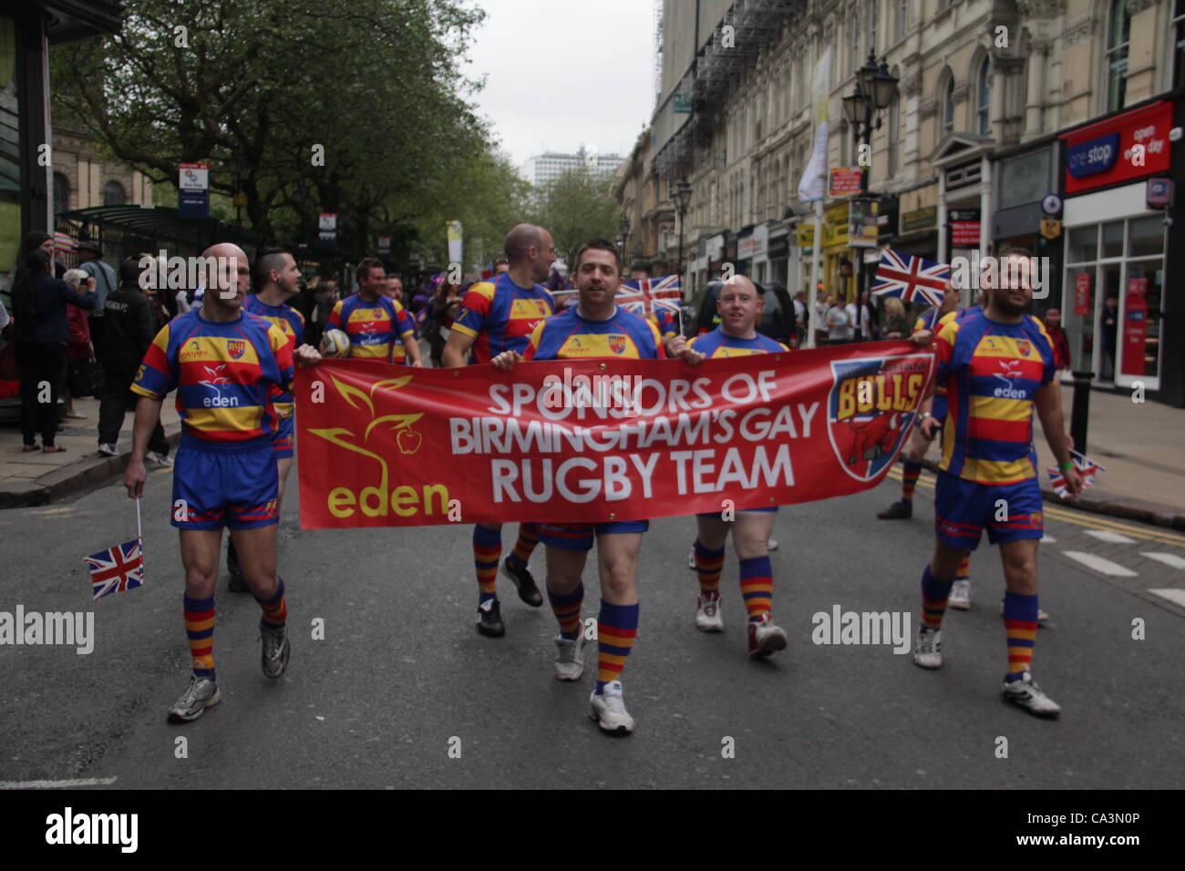 Men dressed in rugby clothes carrying a sign "Sponsors of Birmingham's ...