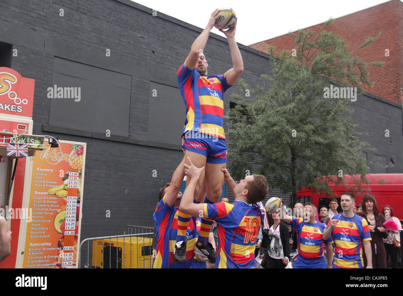 Supporters of Birmingham Rugby Club playing rugby (offside) at ...