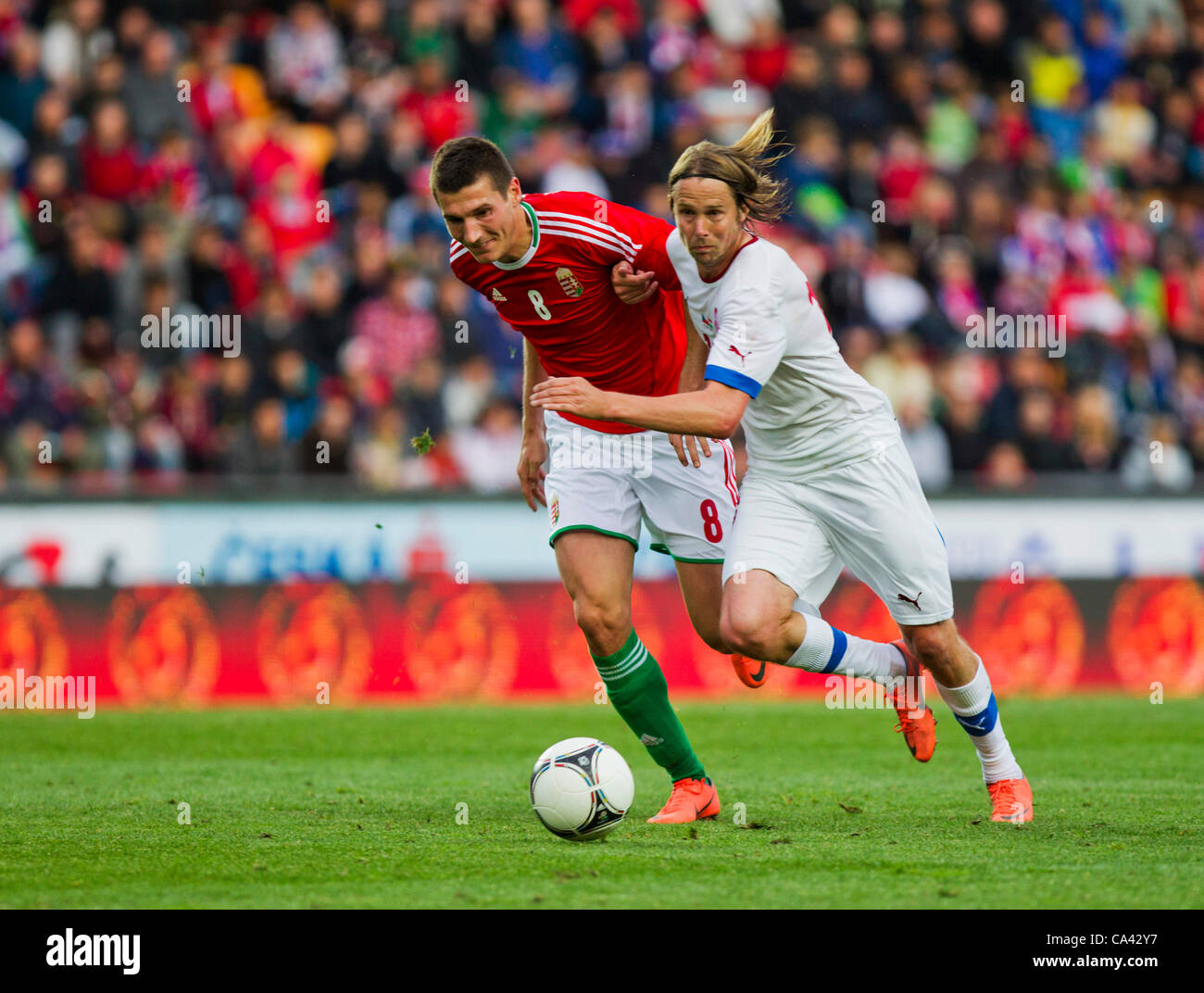 Jaroslav Plasil of Czech Republic (right) challenges for the ball with ...