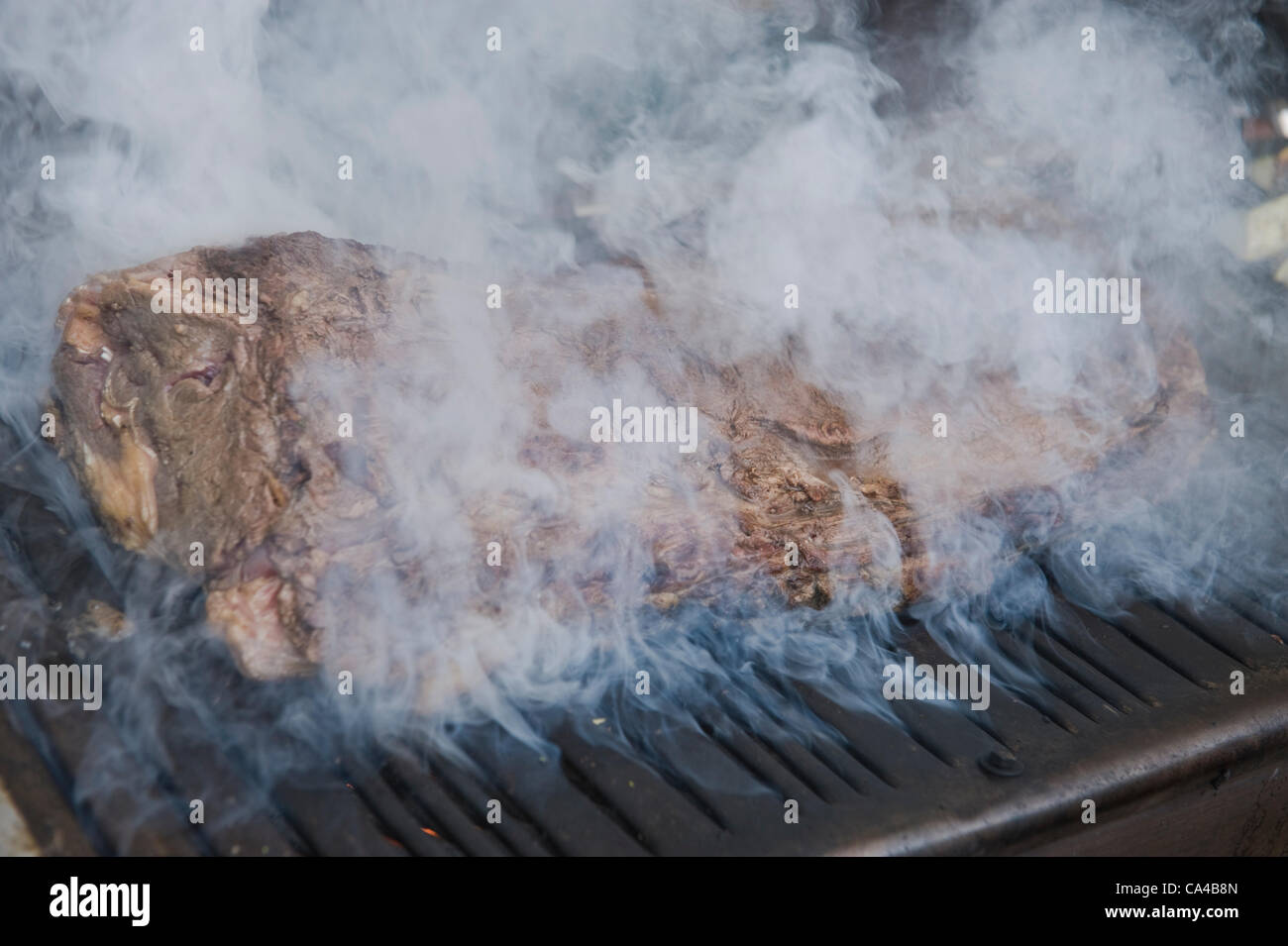 Slab of beef cooking on the barbecue at HowTheLightGetsIn, the ...