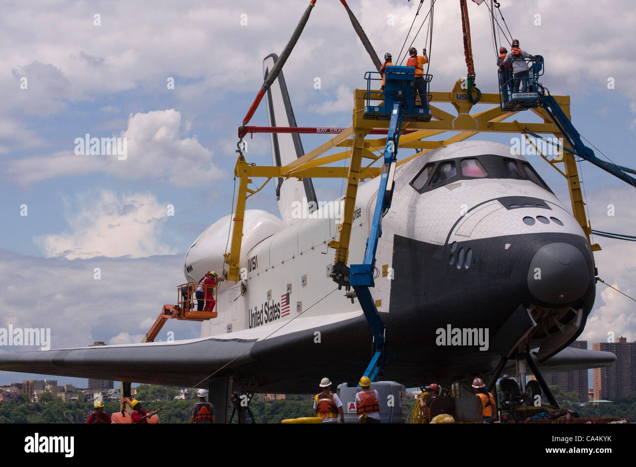 June 6, 2012. New York City USA. Workers from Weeks Marine Team Heavy ...