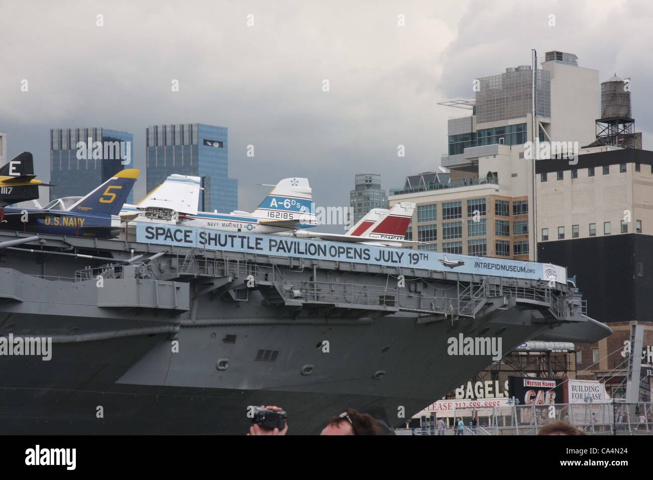 Space Shuttle Enterprise being lifted by a Crane to the Intrepid flight ...