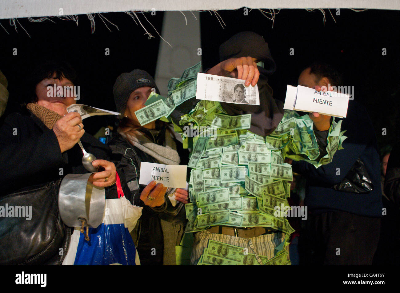 June 7, 2012 - Buenos Aires, Argentina. A man dressed in fake dollars ...