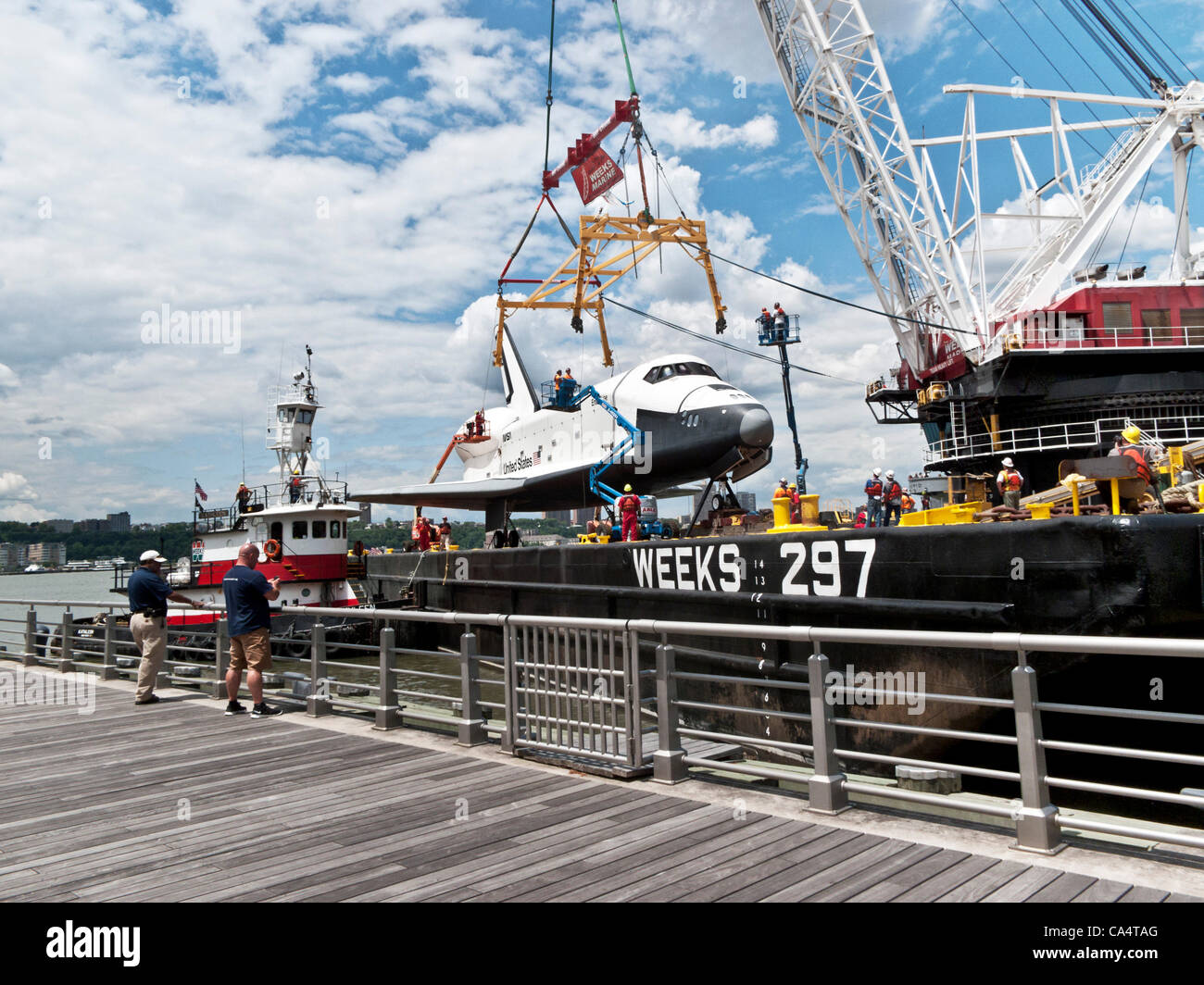 Metal support frame is lowered over space shuttle Enterprise for ...