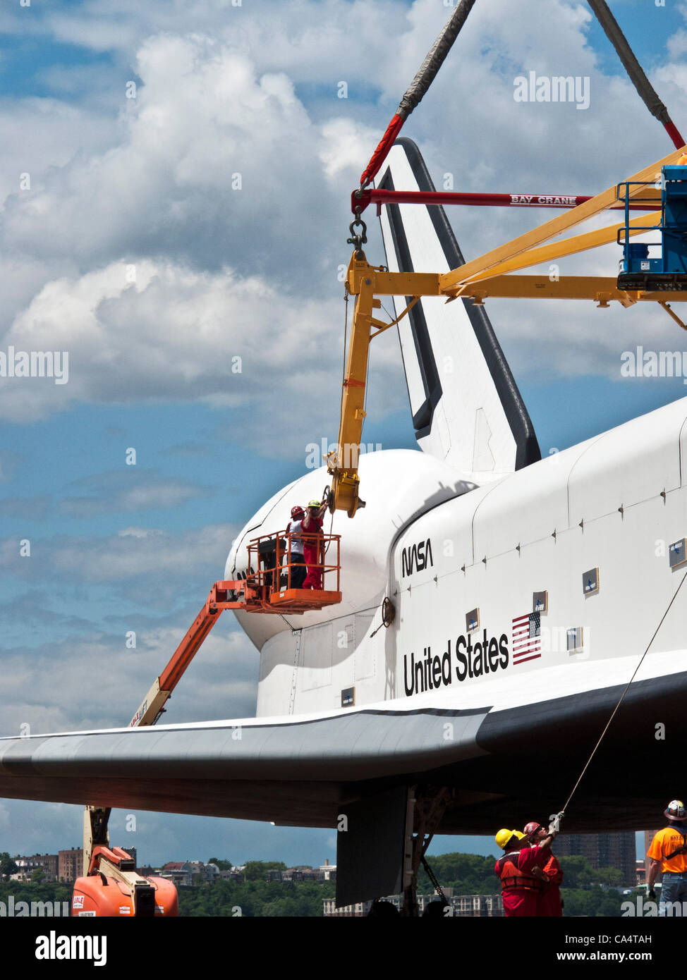 Metal support frame is lowered over space shuttle Enterprise for ...