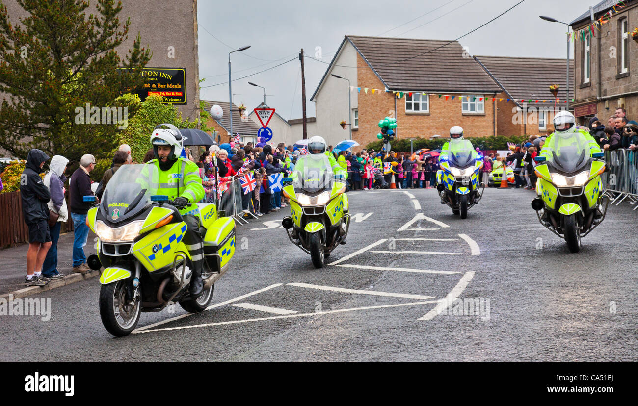 Four police motorcyclists arrive in Barrmill, North Ayrshire, Scotland ...