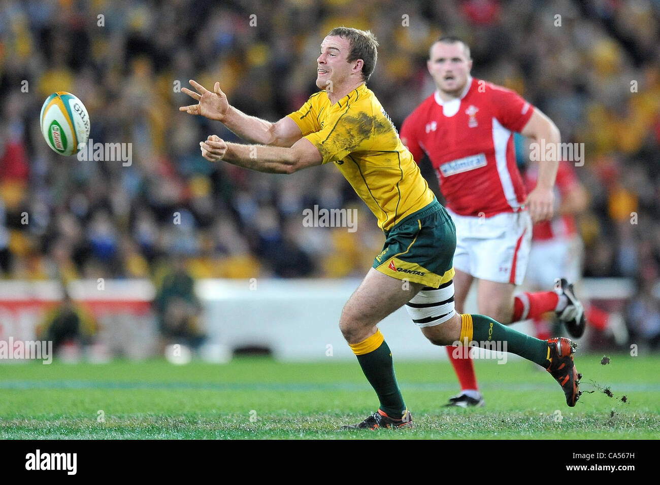 09.06.2012 Brisbane, Australia. Pat McCabe passes to support out wide ...