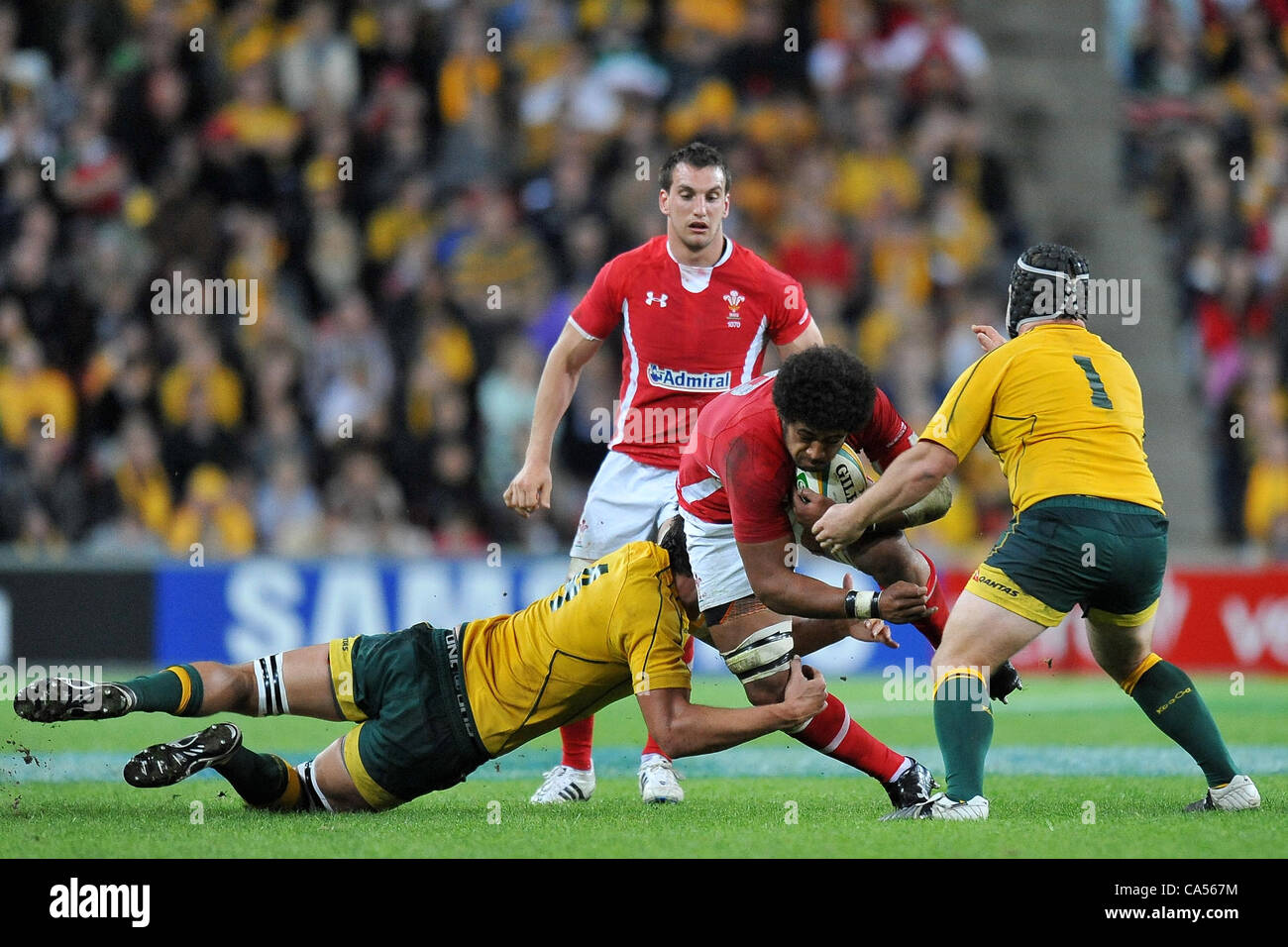 09.06.2012 Brisbane, Australia. Toby Faletau runs into the Australian ...
