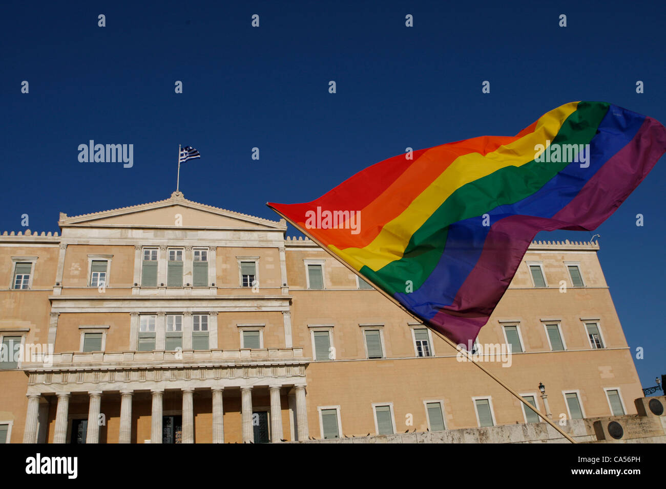 June 9, 2012 - Athens, Greece - A large rainbow flag is waved as the ...