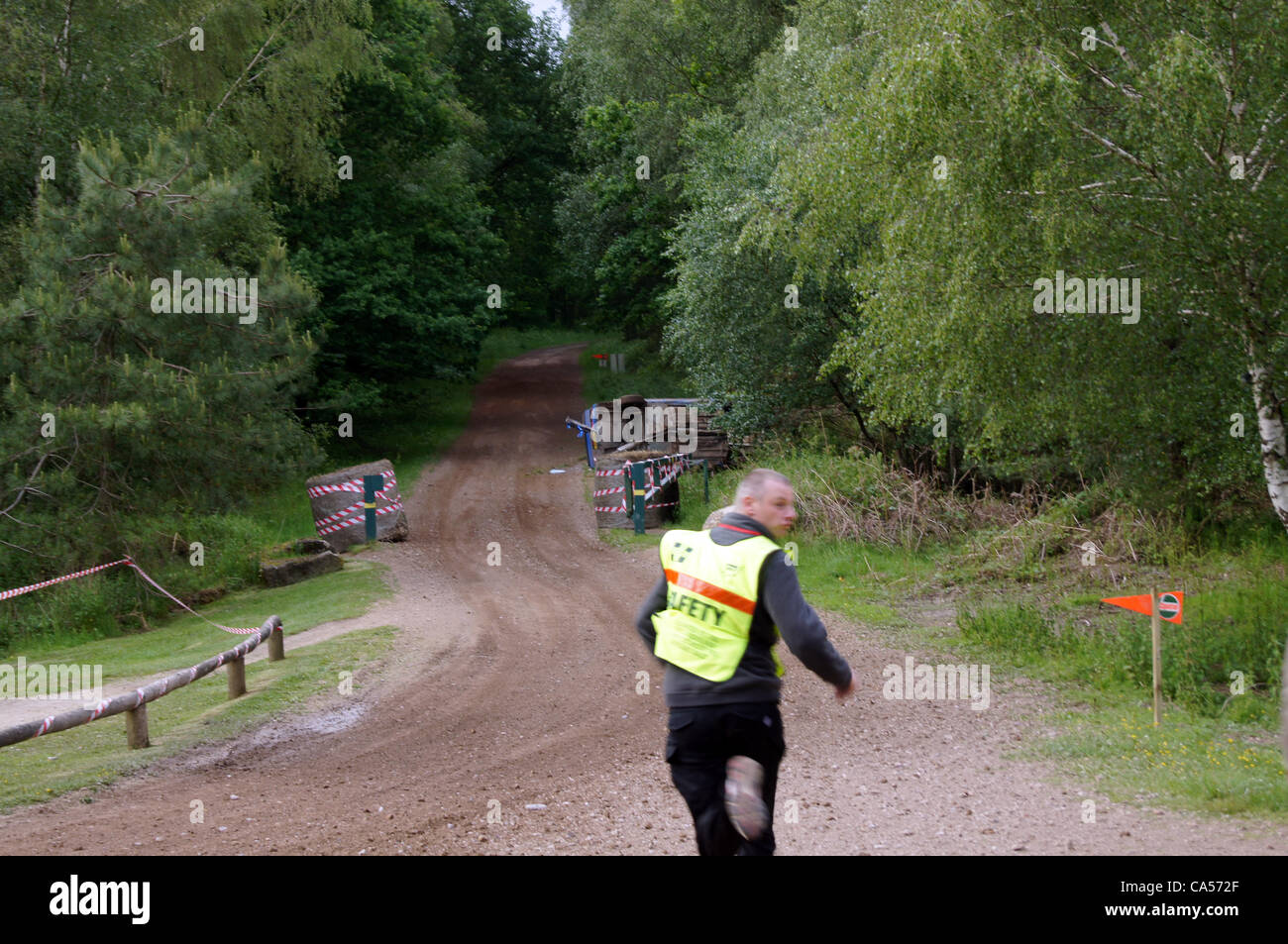 Safety marshal running to the Peugeot 309 driven by Nigel Hunt with ...