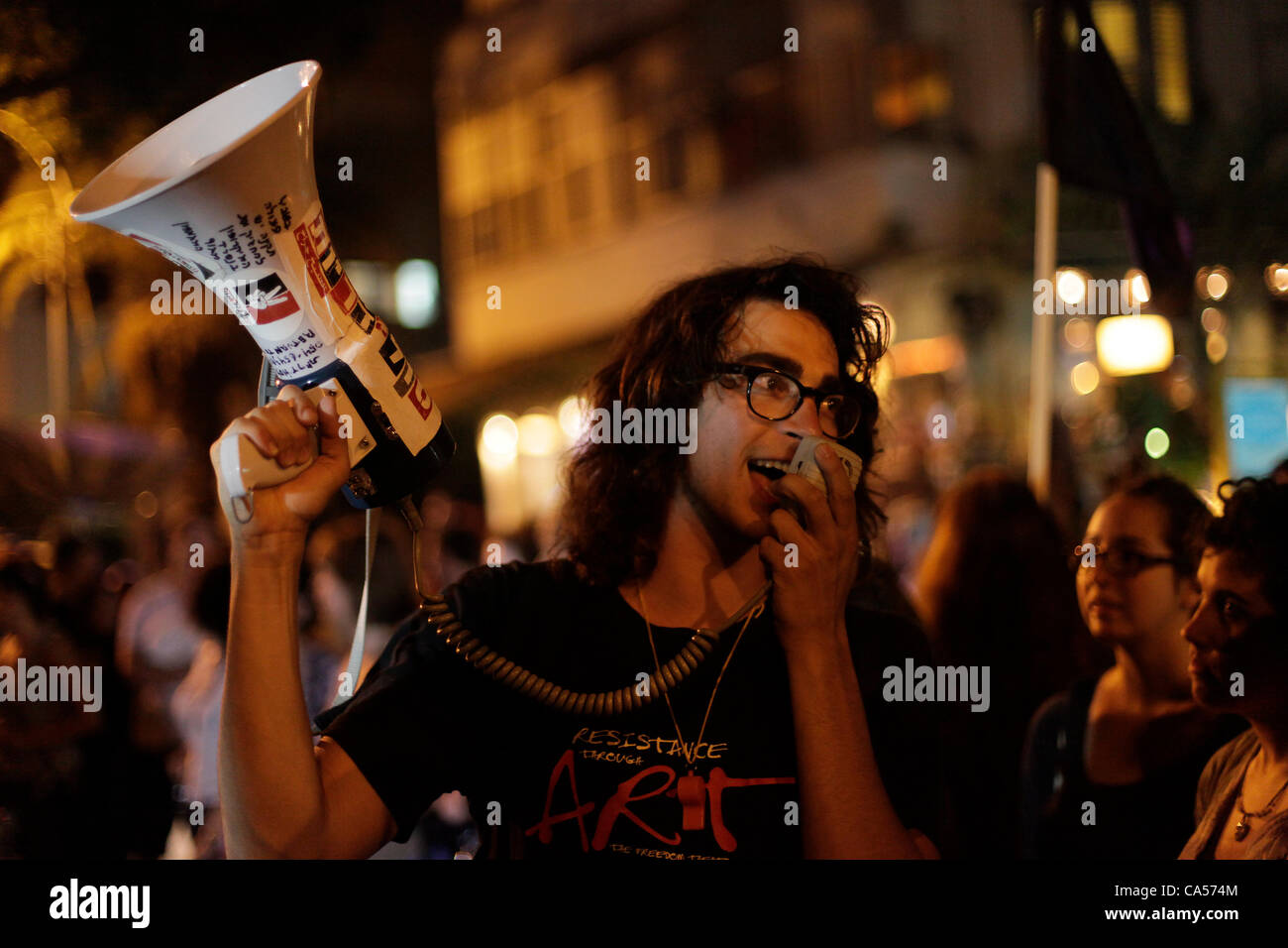 A young Israeli man chant slogans through a bullhorn during Left wing ...
