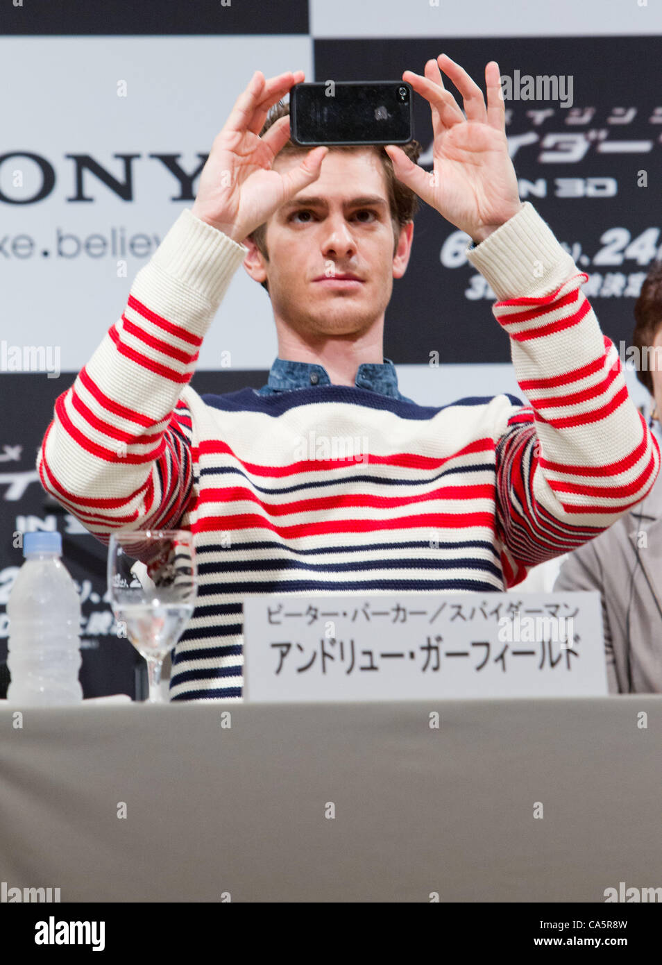 June 13, 2012, Tokyo, Japan - Actor Andrew Garfield takes a photo of ...