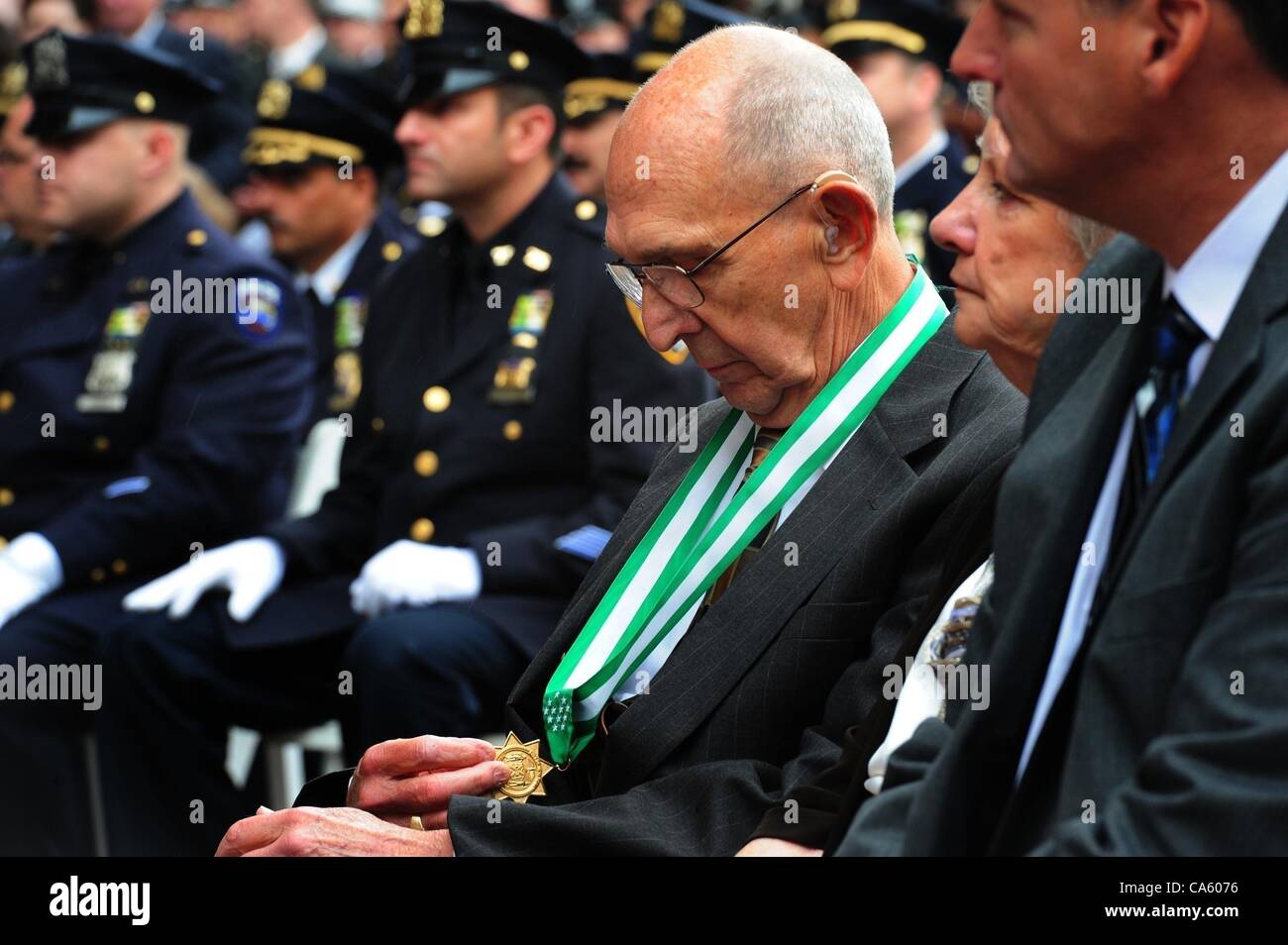 June 12, 2012 - Manhattan, New York, U.S. - FRANK FIGOSKI, surrounded ...