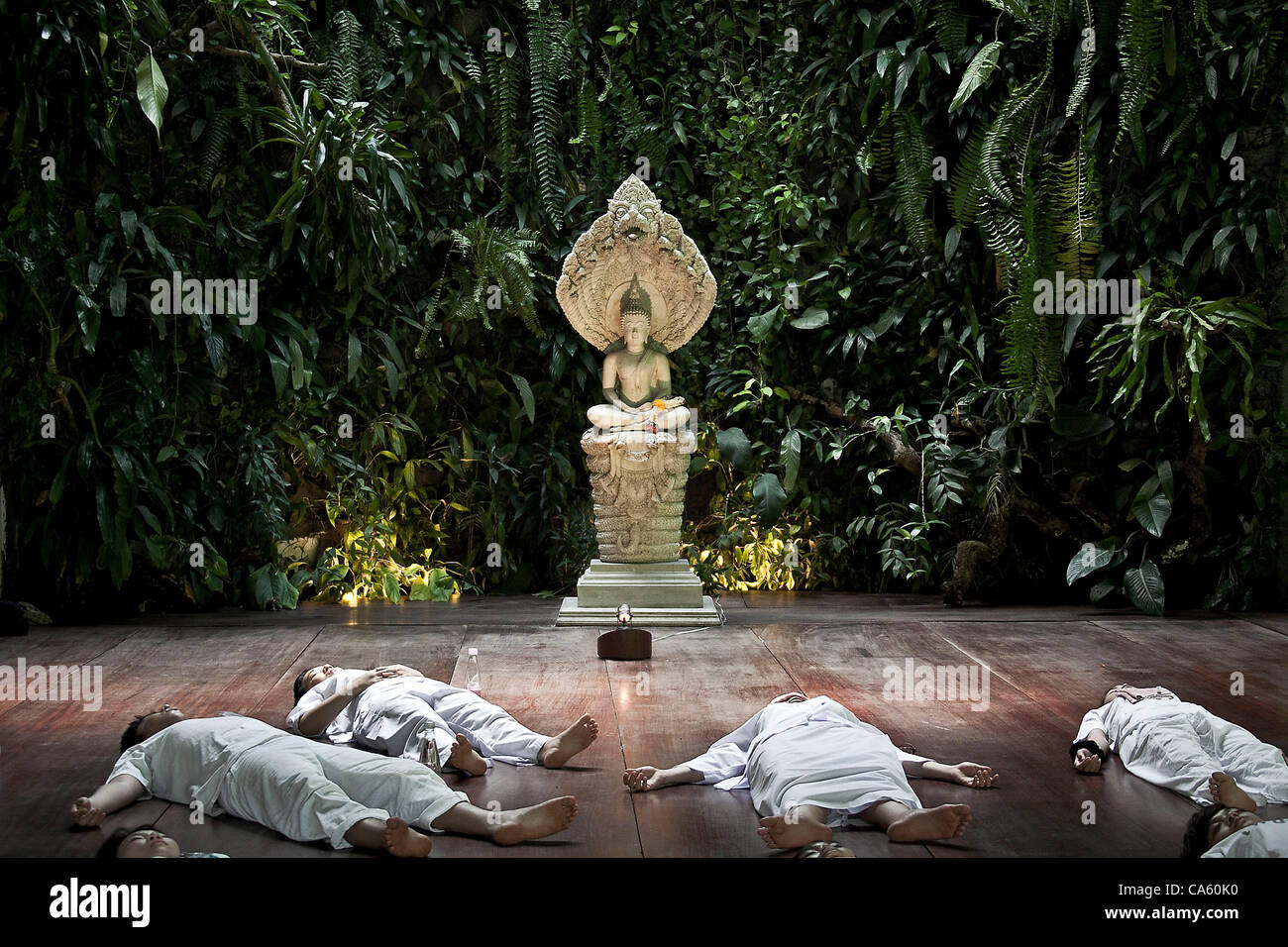 A Thai female group performs a laying meditation as part of the Sathira ...