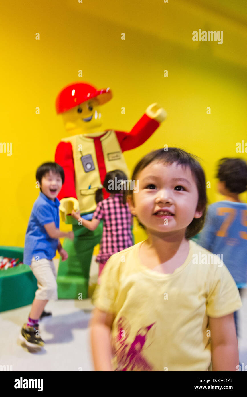 June 14, 2012, Tokyo, Japan - Kids play with a giant Lego man during a ...