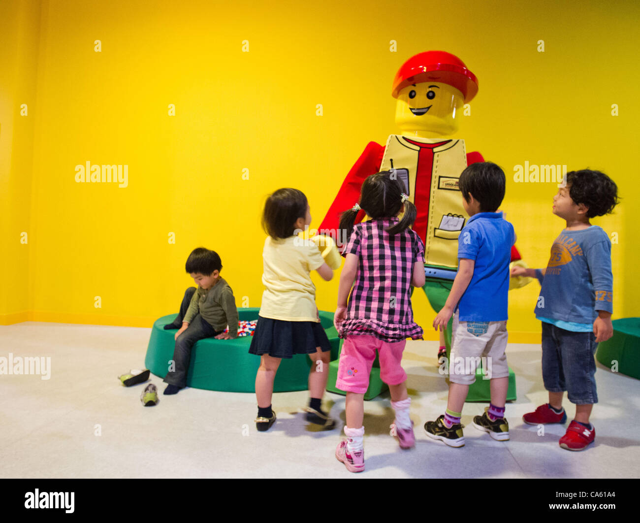 June 14, 2012, Tokyo, Japan - Kids play with a giant Lego man during a ...