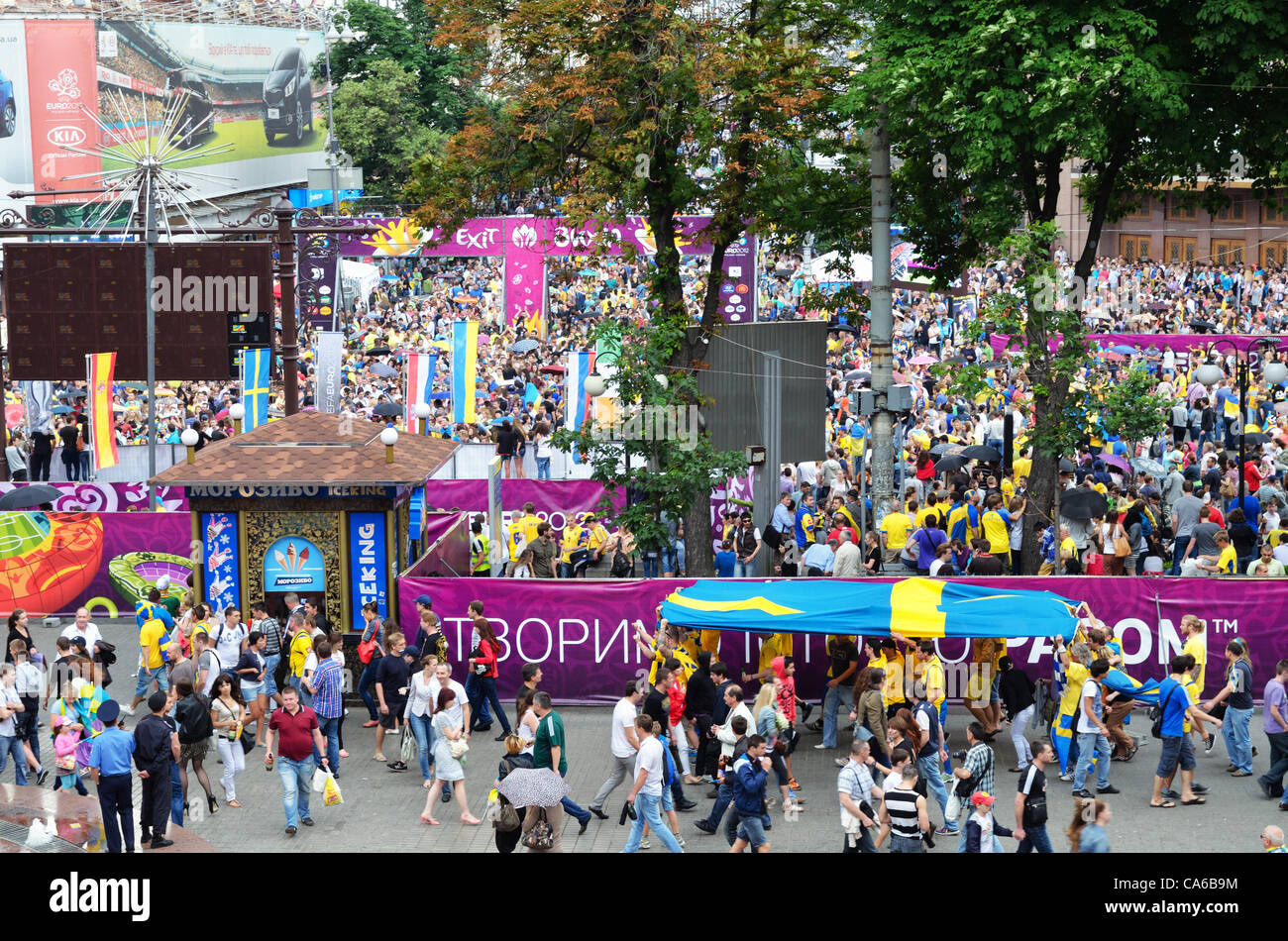 KIEV, UKRAINE - JUNE 15: Ukrainian fans in the fan zone in Kiev watch ...