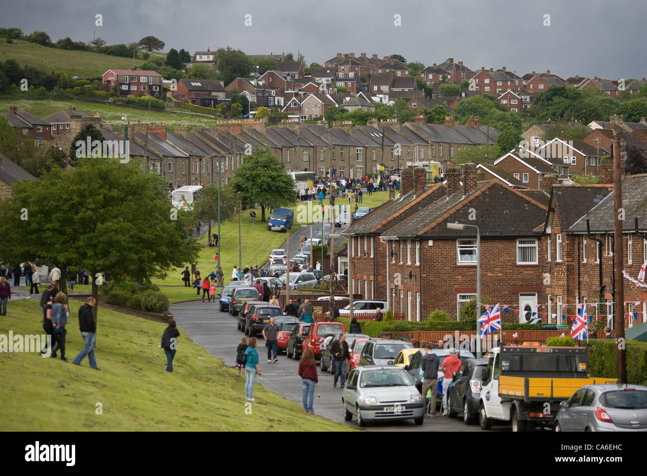 Long shot of the 2012 Olympic Torch Relay at Castleside, near Consett ...