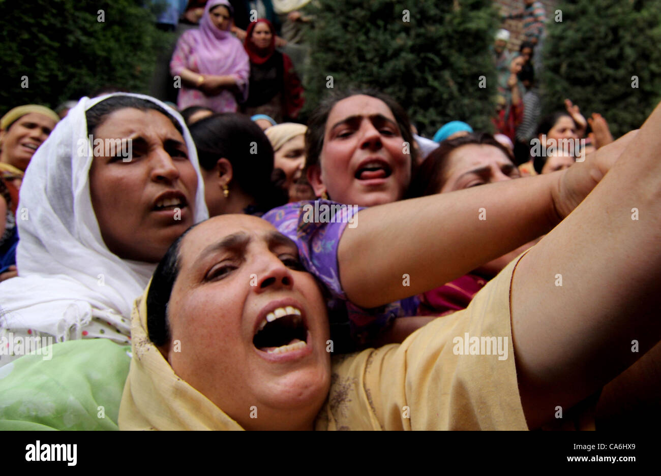 An Kashmiri Muslim women wail during the funeral procession of ruling ...