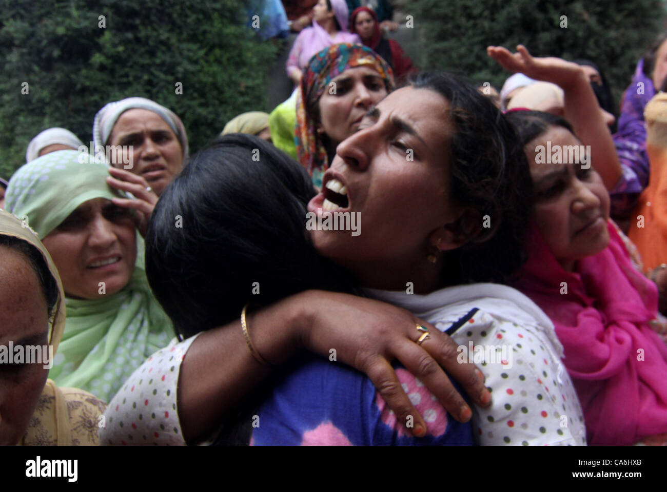 An Kashmiri Muslim women wail during the funeral procession of ruling ...