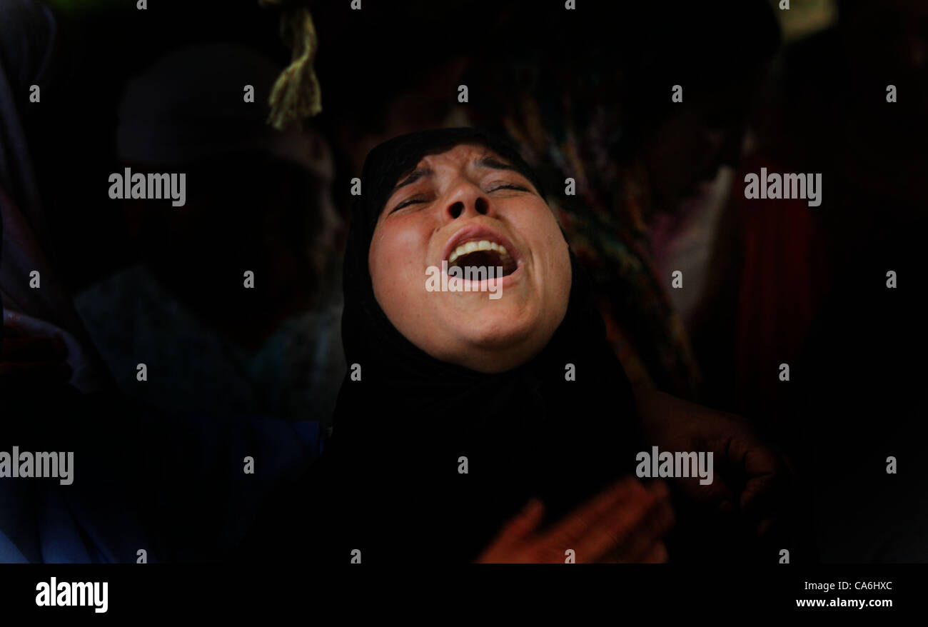 A Kashmiri Muslim women wail during the funeral procession of ruling ...