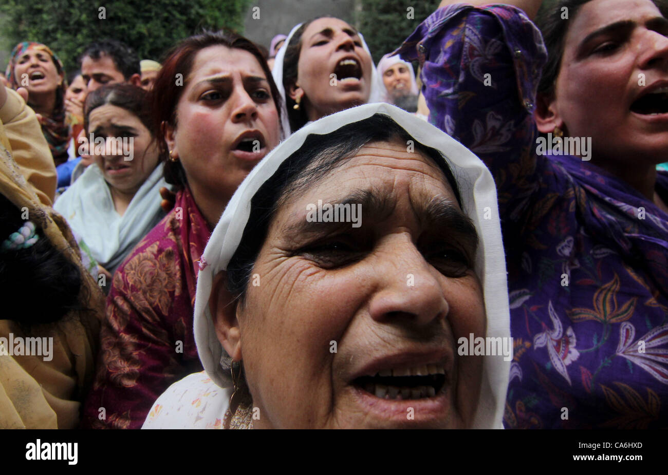 An Kashmiri Muslim women wail during the funeral procession of ruling ...