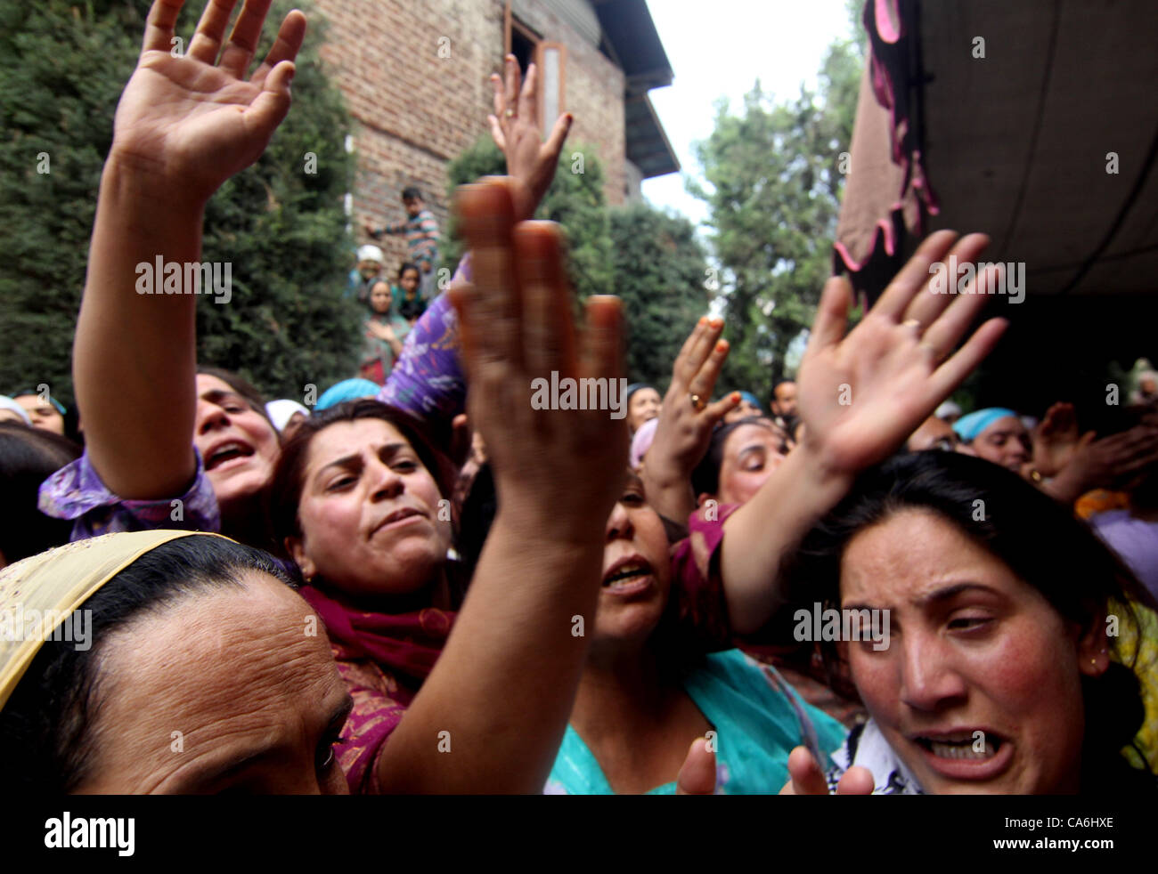 An Kashmiri Muslim women wail during the funeral procession of ruling ...